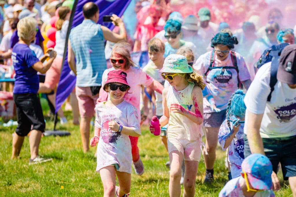 Runners chase the rainbow at annual Colour Fun Run - Rennie Grove Peace ...